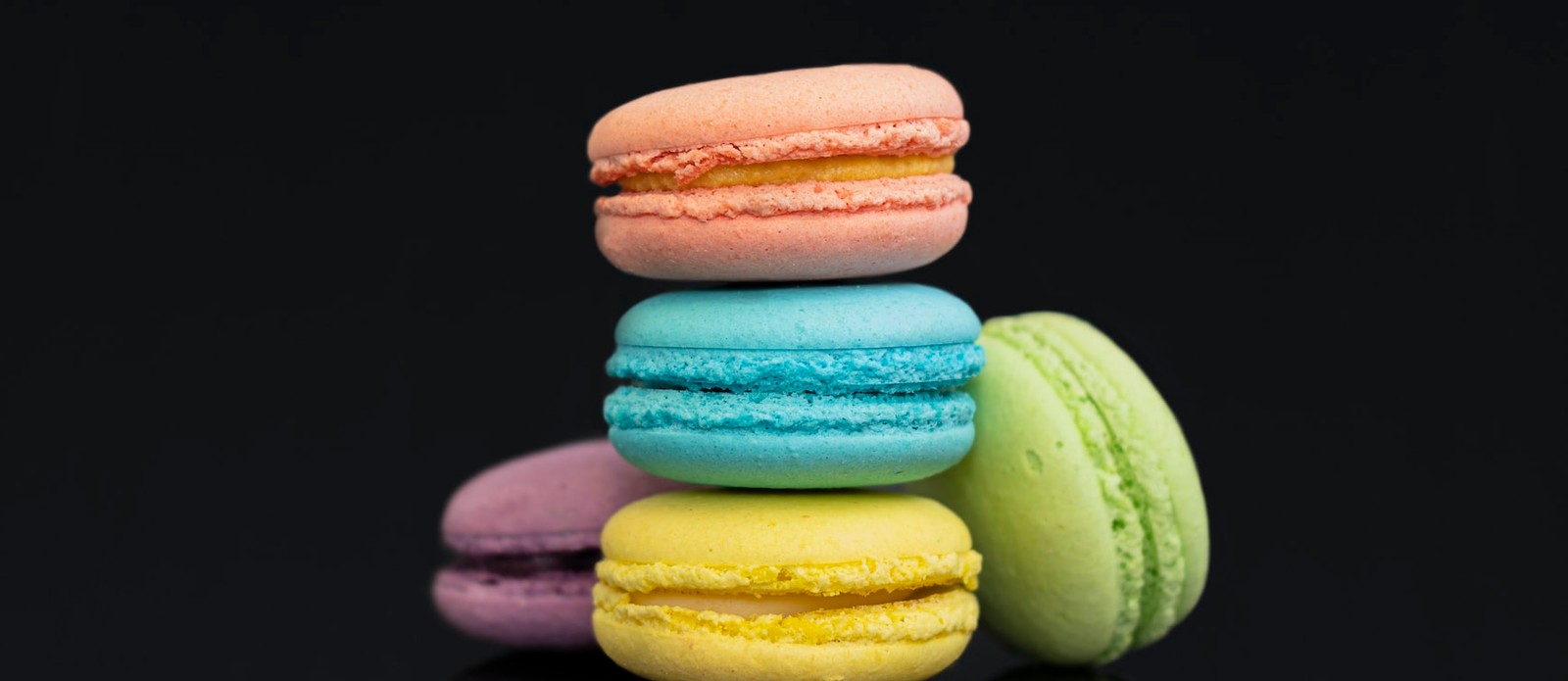 Which nut is an essential ingredient of French macarons?